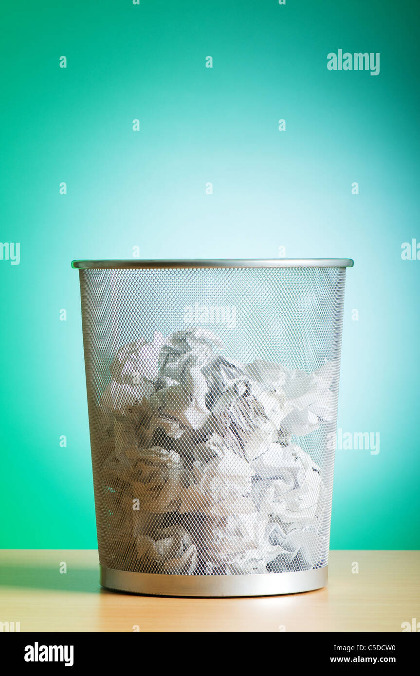 Garbage bin with paper waste isolated on white Stock Photo - Alamy