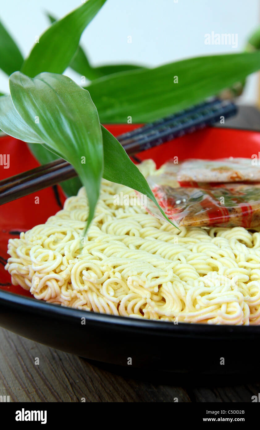 Instant Asian noodle fast food with chopsticks in a red cup Stock Photo ...