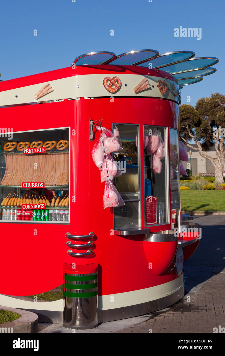 Fast food vendors stand selling hot dogs pretzels churros and corndogs ...