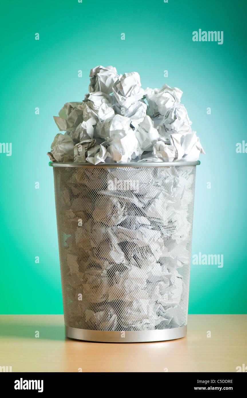 Garbage bin with paper waste isolated on white Stock Photo - Alamy