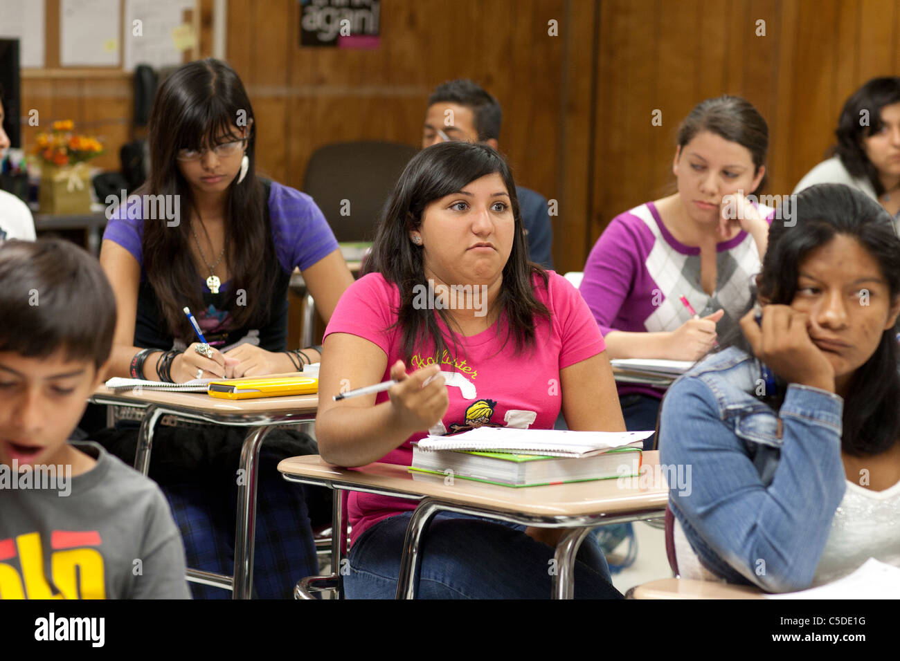 Hispanic female high school student shrugs in classroom at Texas State ...