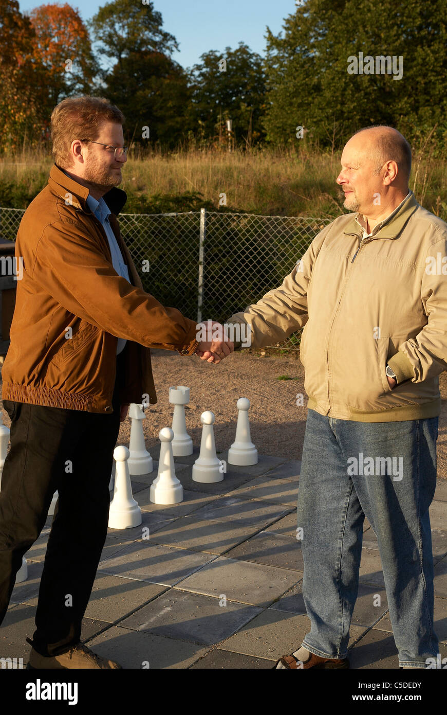 Old men greet hi-res stock photography and images - Alamy