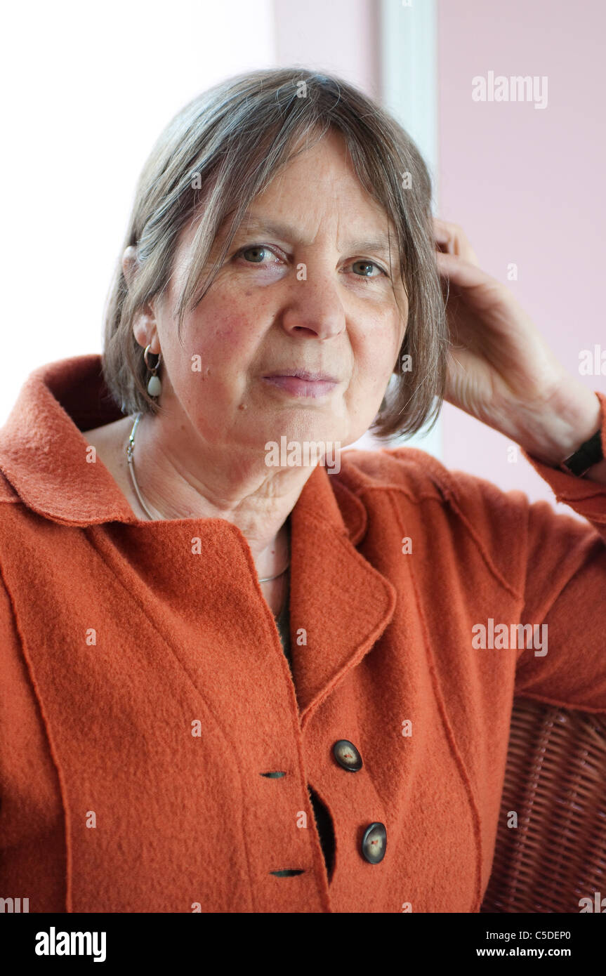 Middle aged woman looking at the camera Stock Photo - Alamy