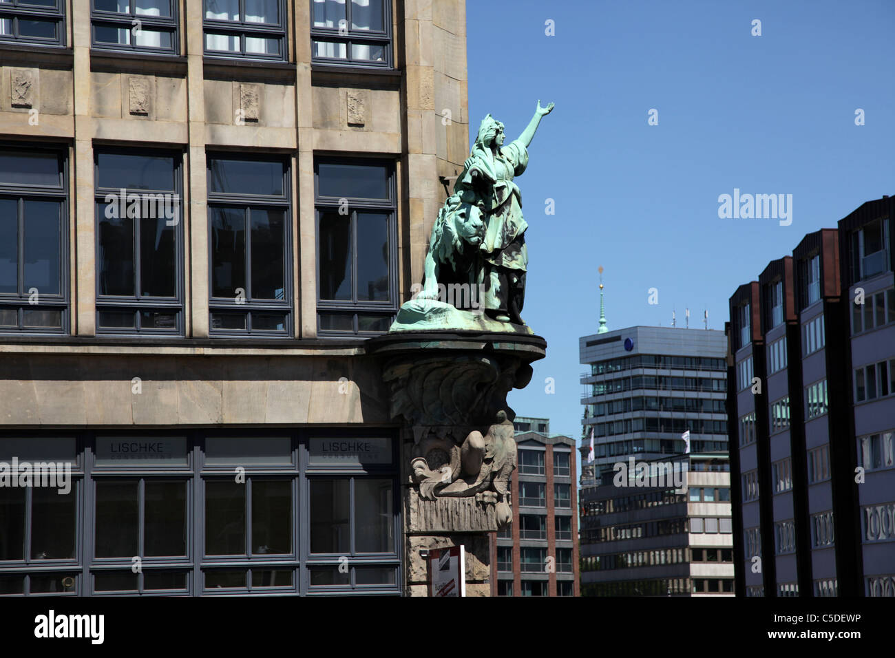 Bronze sculpture adorning building in Hamburg Stock Photo - Alamy