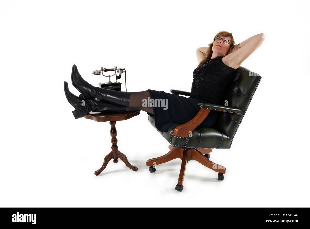 Feet sitting in a chair hi-res stock photography and images - Alamy