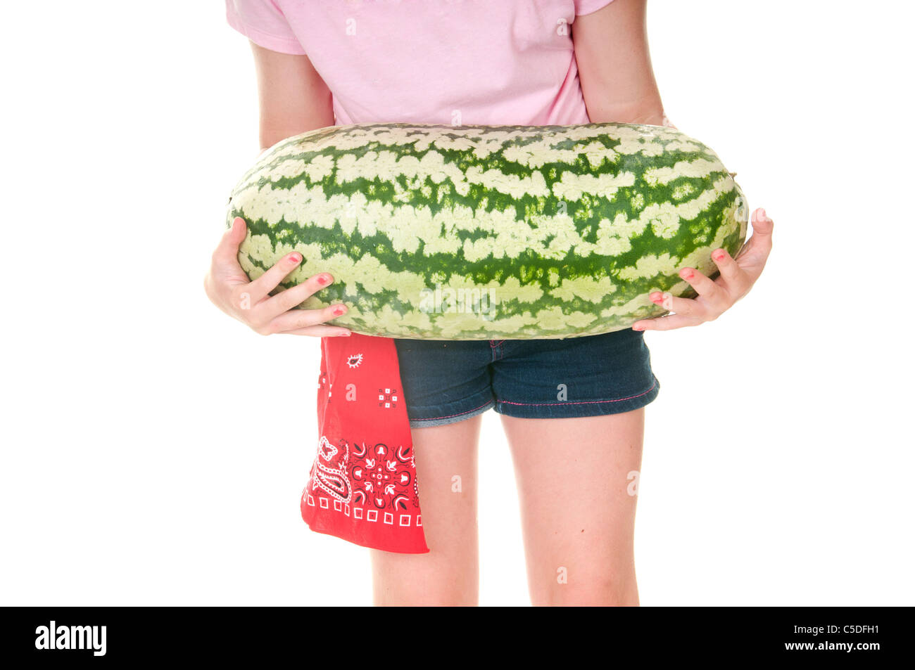 Girl gardener carrying huge fresh watermelon Stock Photo - Alamy