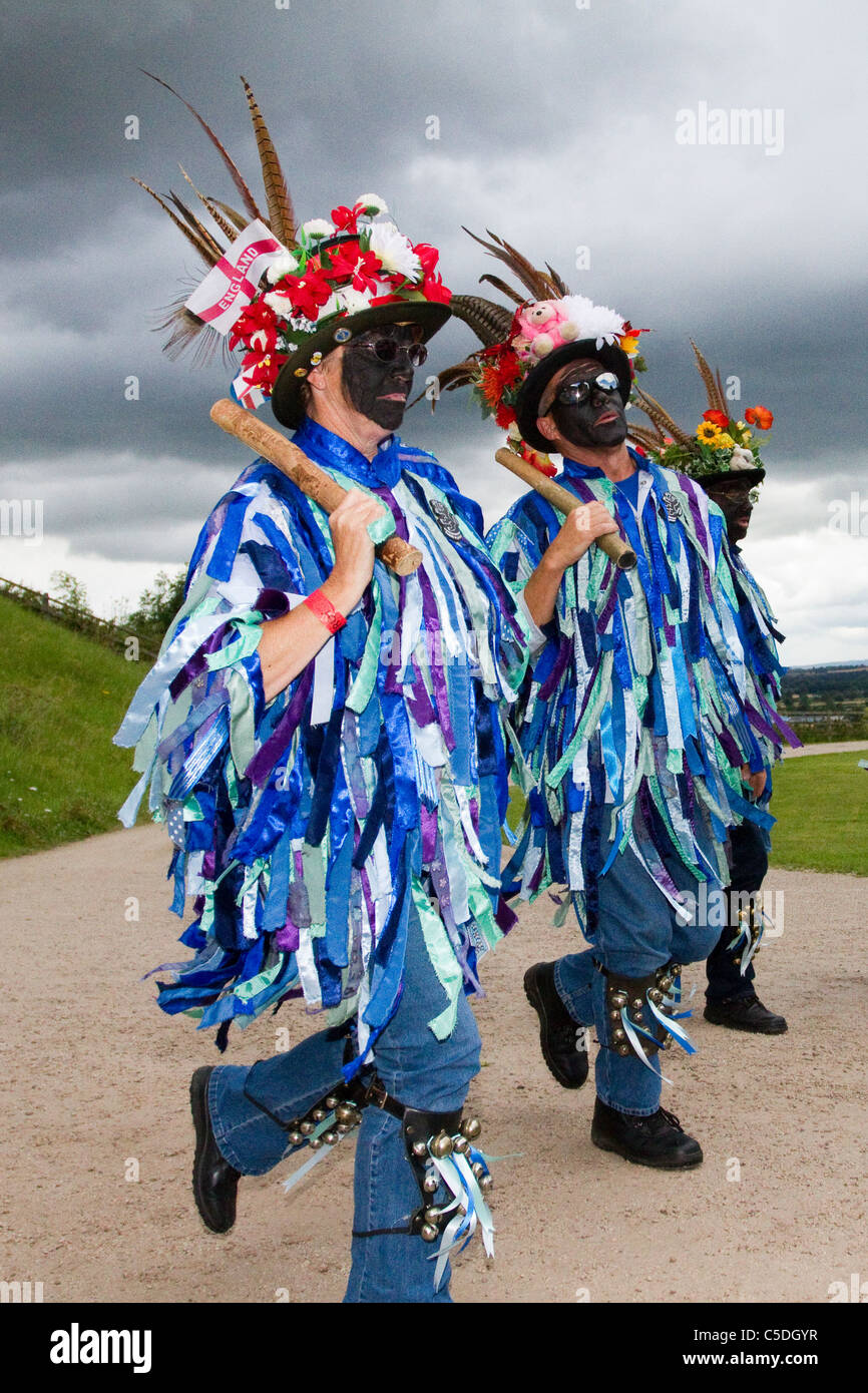 Exmoor Border Morris Dancers, black-faced, wearing long flowing torn ...