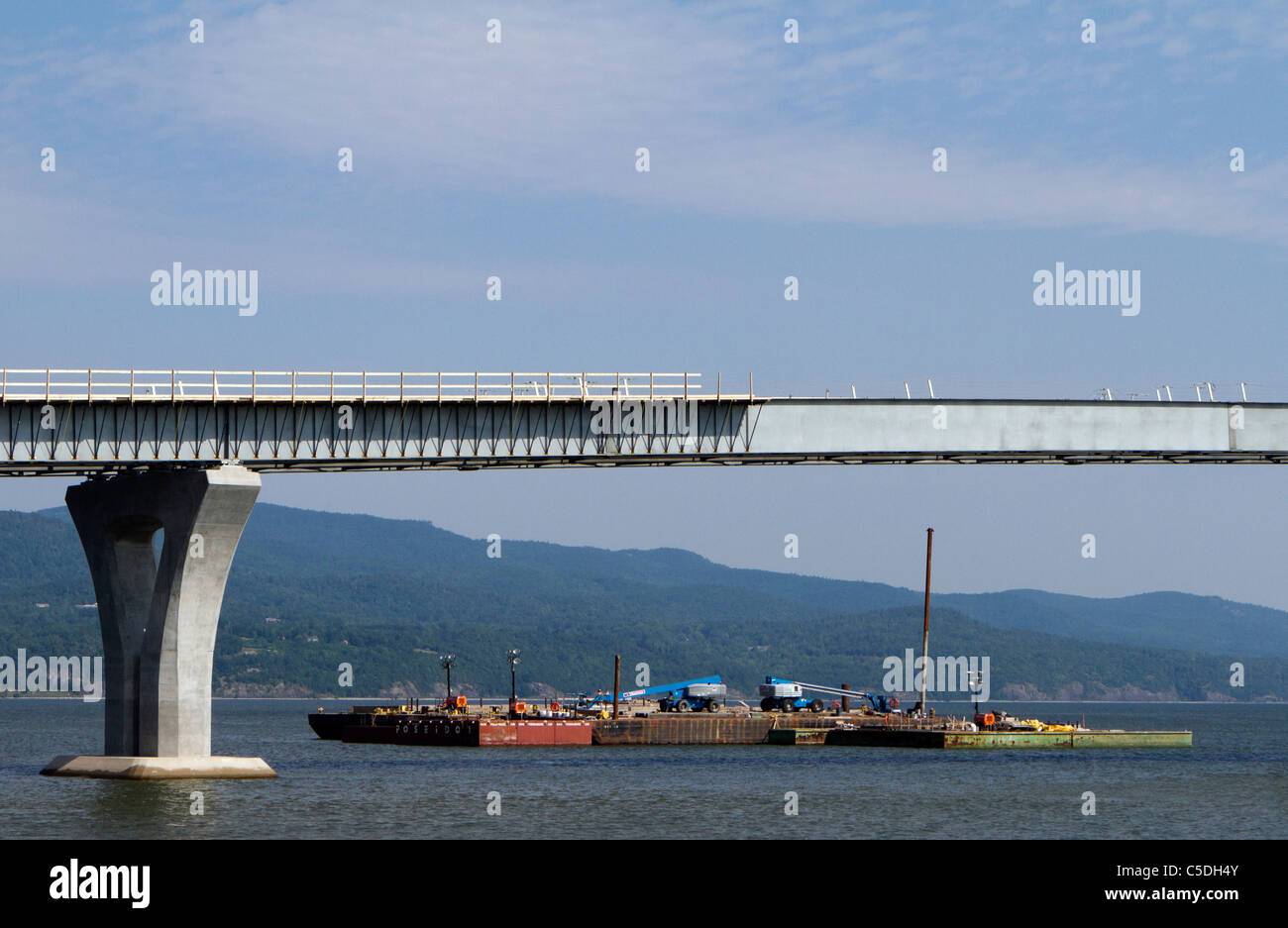 Bridge construction barge derricks cranes Stock Photo - Alamy