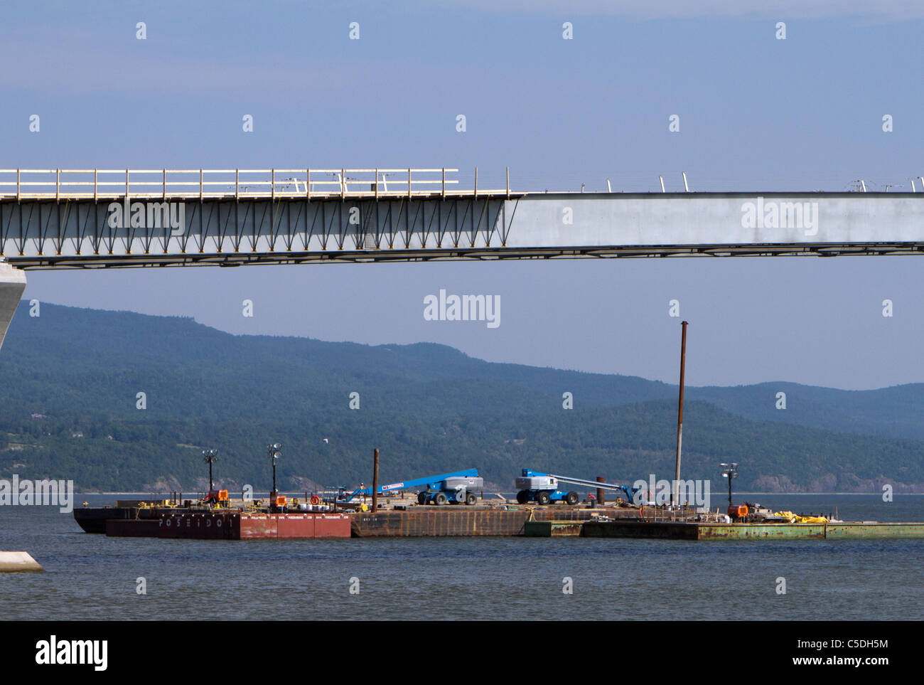 Bridge construction barge derricks cranes Stock Photo - Alamy
