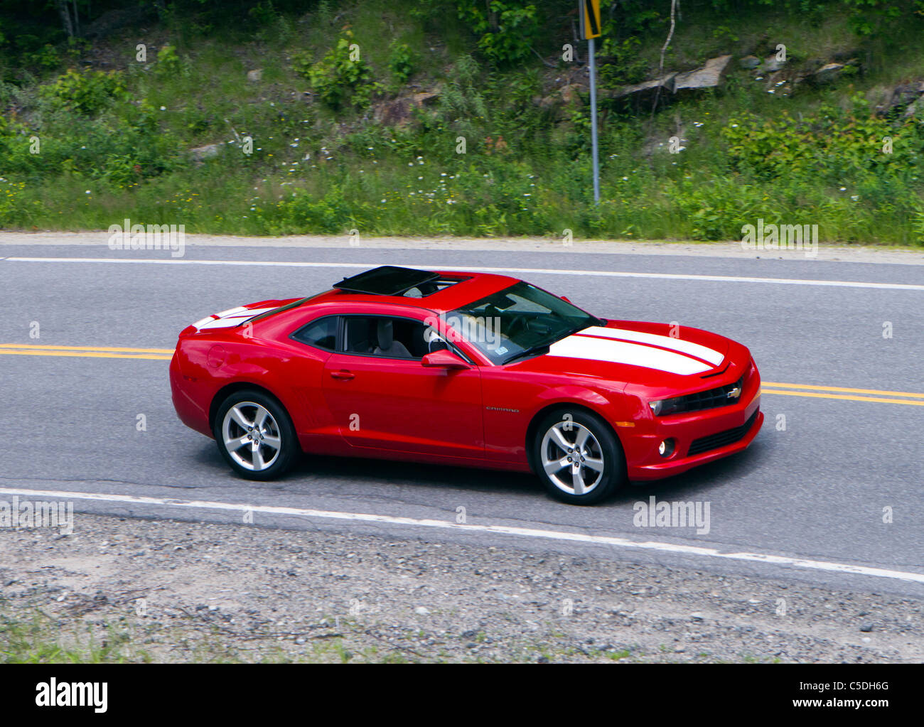 Red Chevrolet Camaro with white racing stripes Stock Photo - Alamy