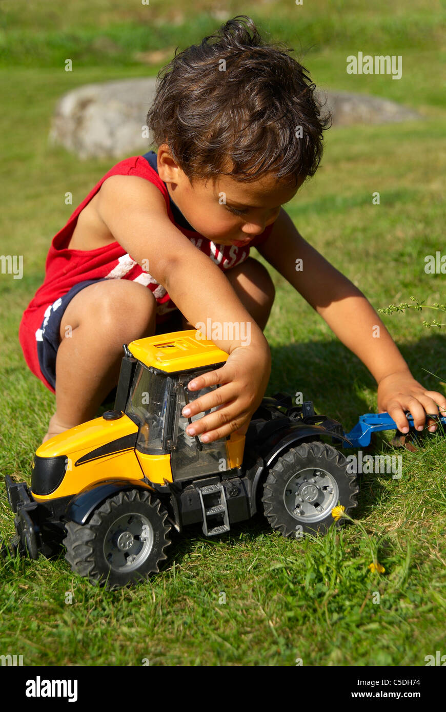 Boy on tractor hi-res stock photography and images - Alamy