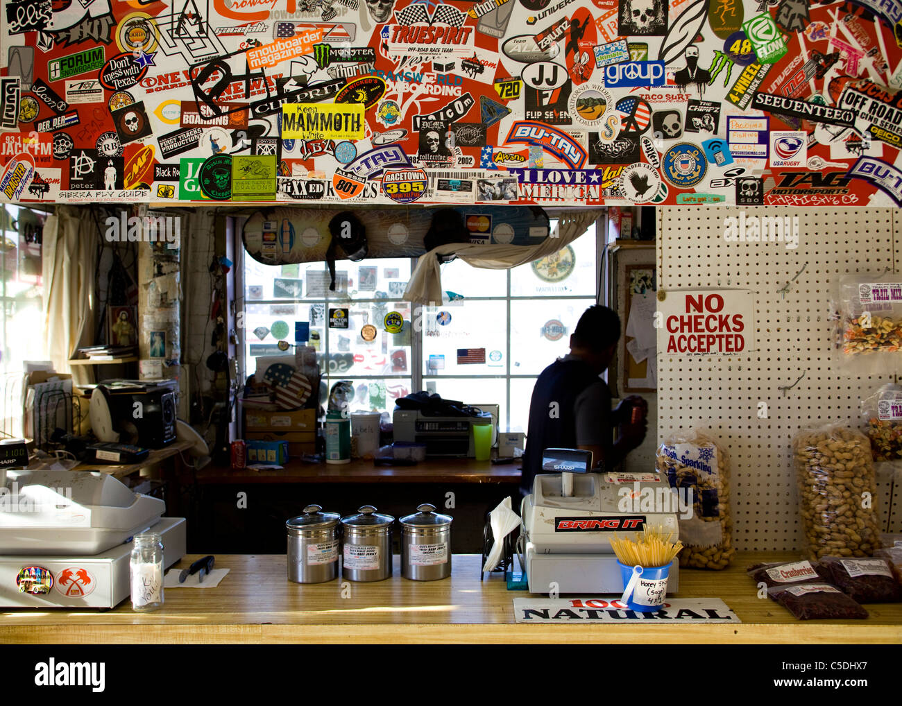 A checkout counter area fully covered with stickers of all sorts Stock ...