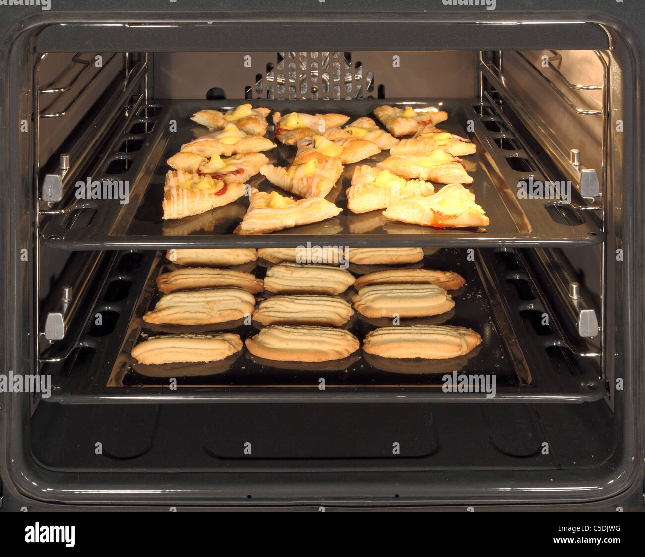 Fresh baked homemade cookies in oven Stock Photo - Alamy