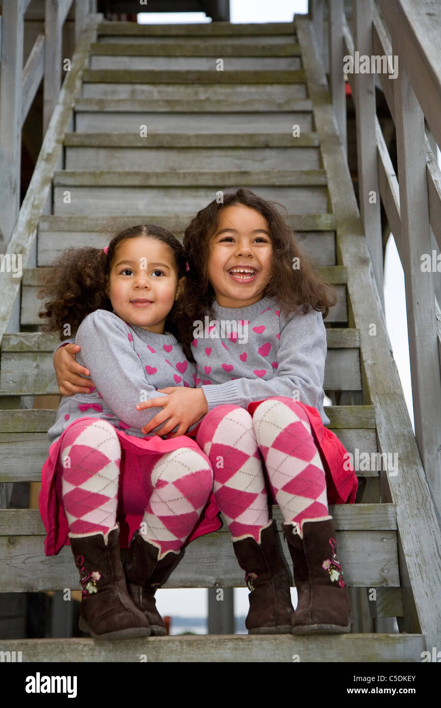 Two people sitting on stairs hi-res stock photography and images - Alamy