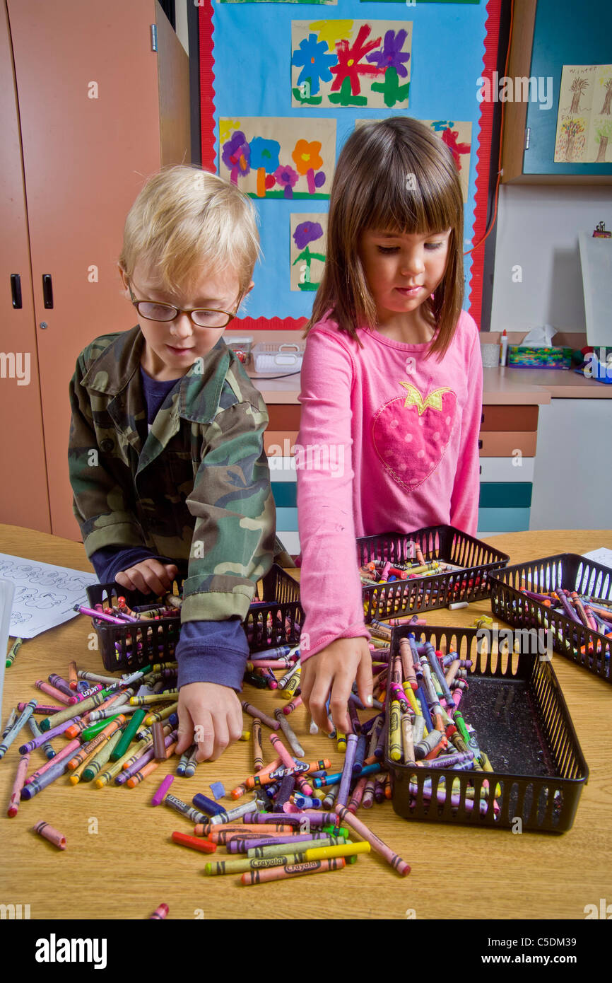 Kindergarten children in San Clemente, CA, collect and organize a table ...