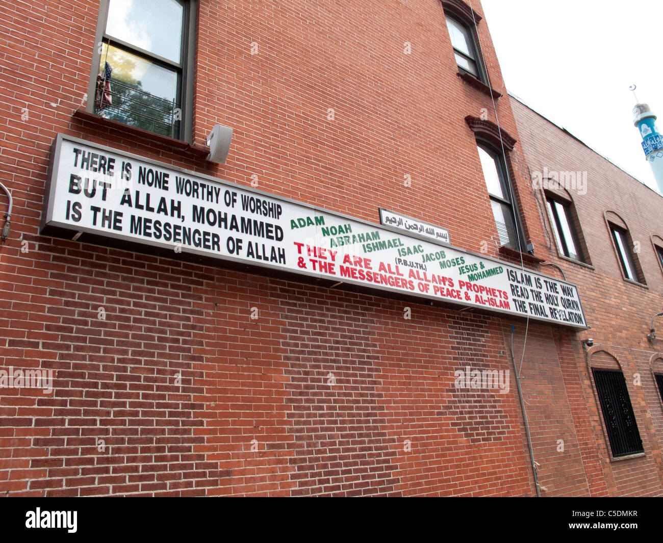 A sign proclaims an Islamic message near a mosque on the lower east ...