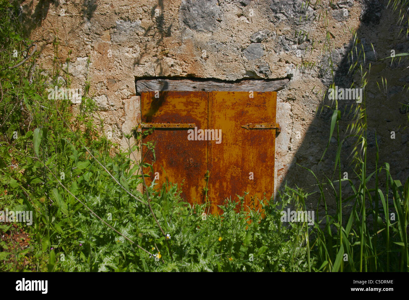 Rusty metal door in Greek village on Cephalonia Stock Photo - Alamy