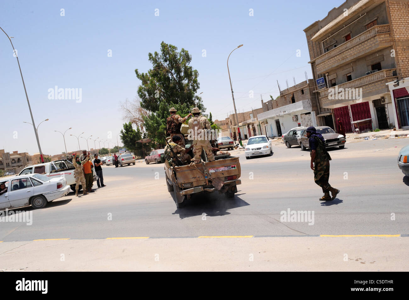 A civil war between Gaddafi army and Libya's Transitional National Council army with air support ...