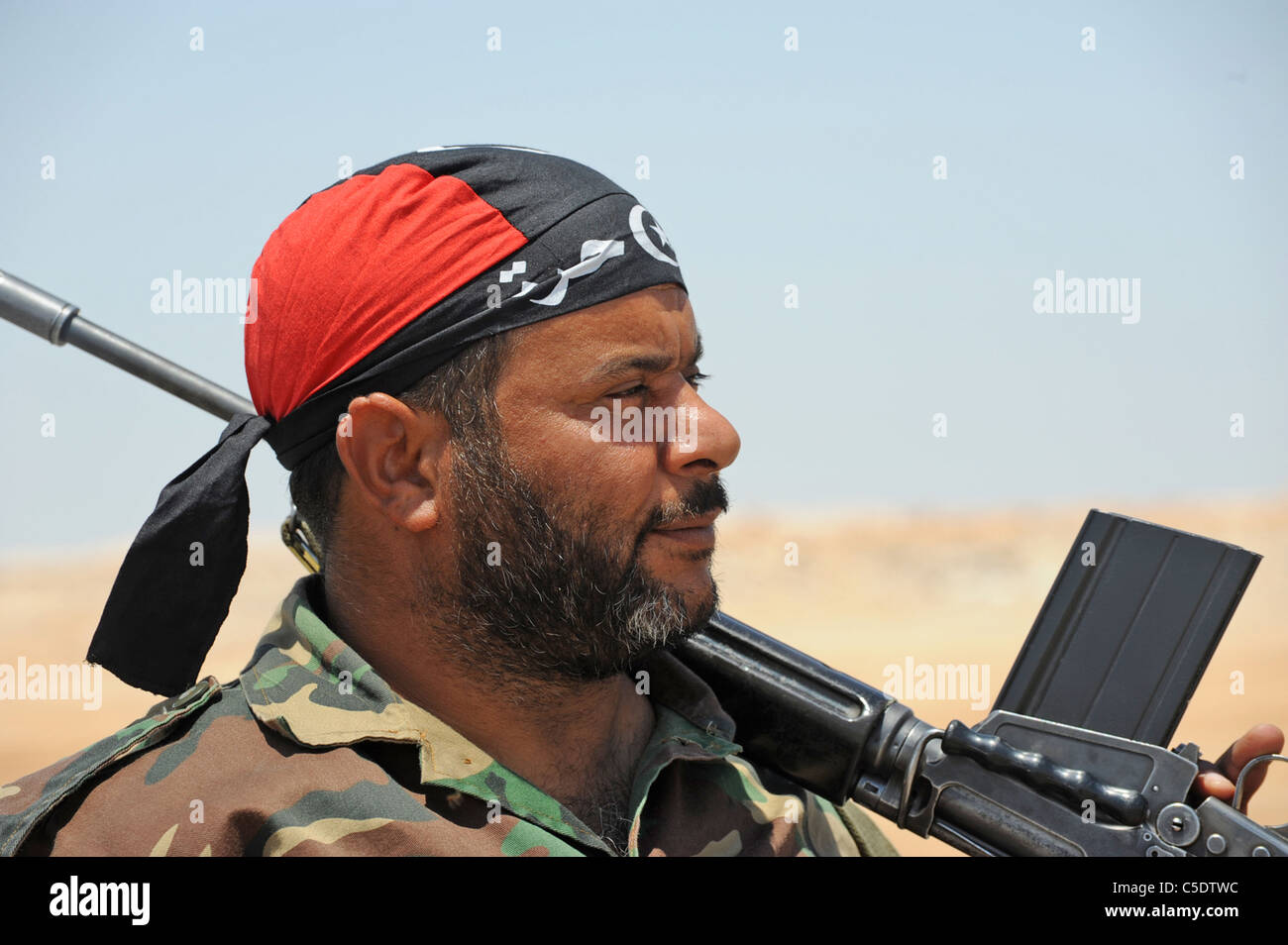 A civil war between Gaddafi army and Libya's Transitional National Council army with air support ...