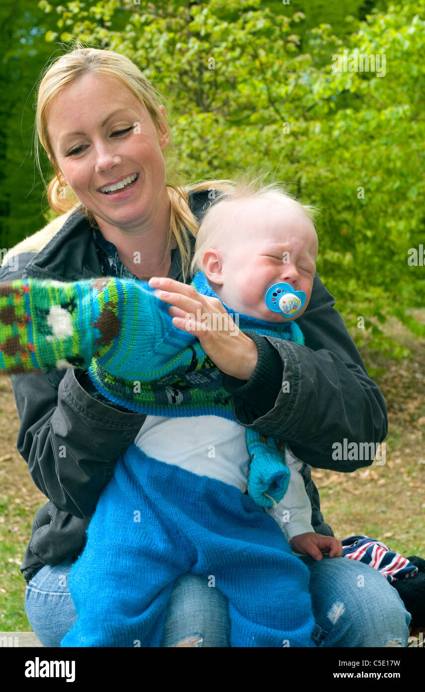 Baby resisting mother hi-res stock photography and images - Alamy