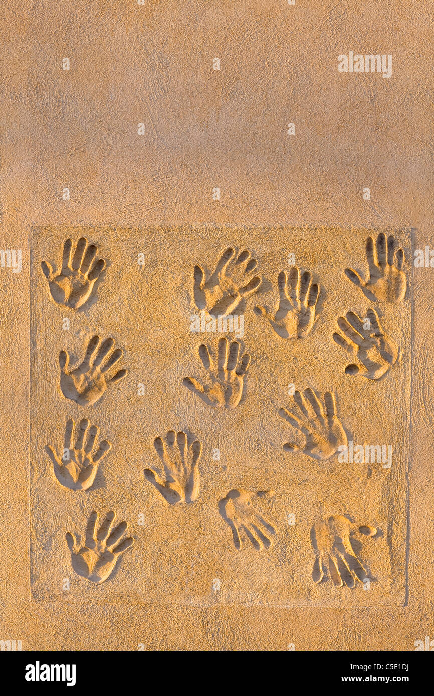 Close-up of handprints on brown surface Stock Photo - Alamy