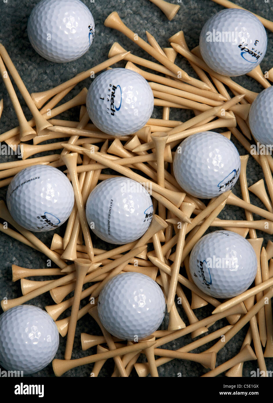 A golf-themed abstract still life, made up of 10 shiny new golf balls ...