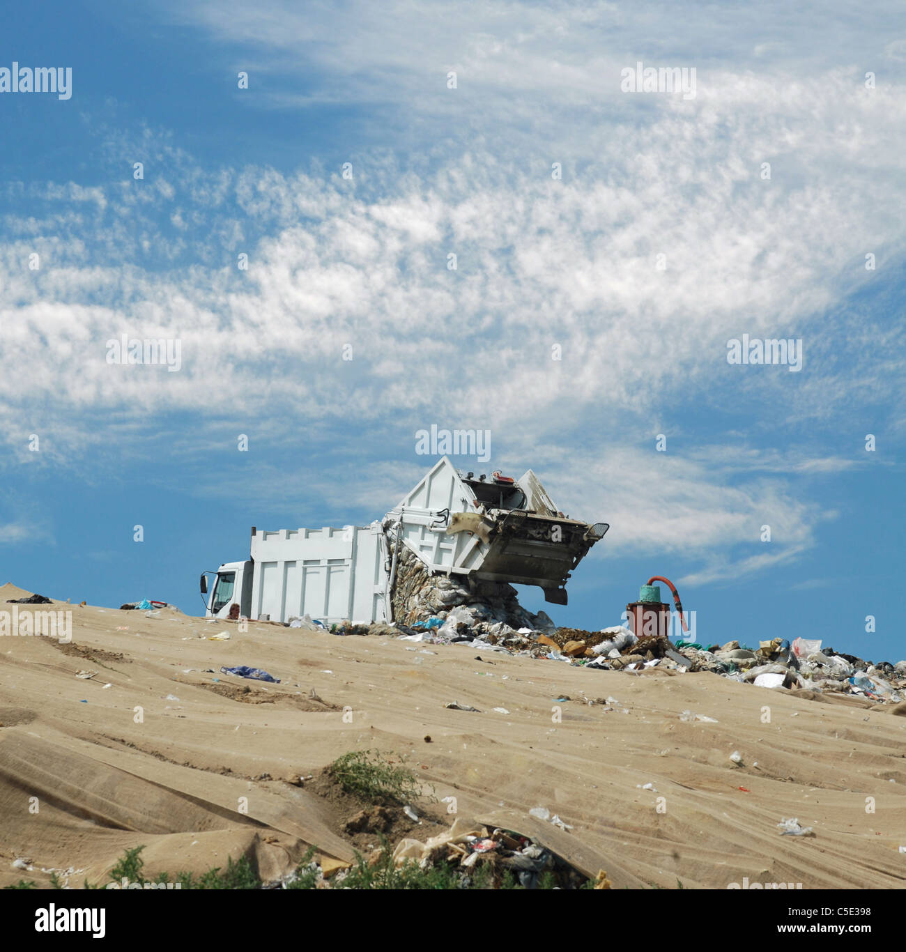 The garbage truck unloads dust on a dump Stock Photo - Alamy