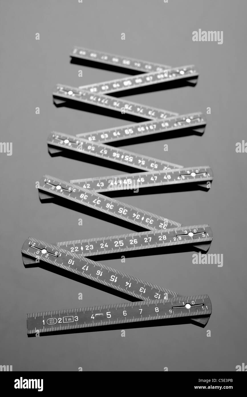 Close-up of a black folding rule against gray background Stock Photo ...