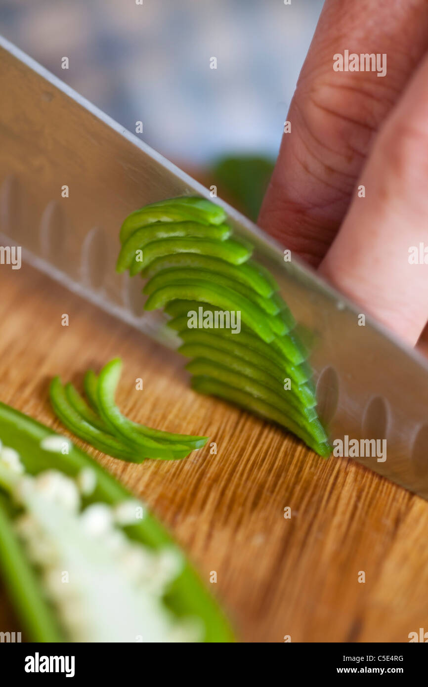 Chopping Chilli peppers Stock Photo - Alamy