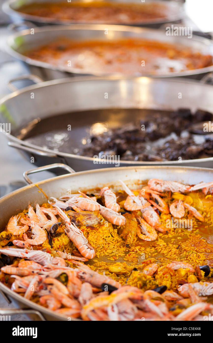 Paella for sale in street market stall, France Stock Photo - Alamy