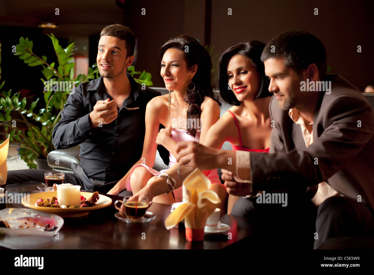 young couples having fun over dessert and coffee Stock Photo - Alamy