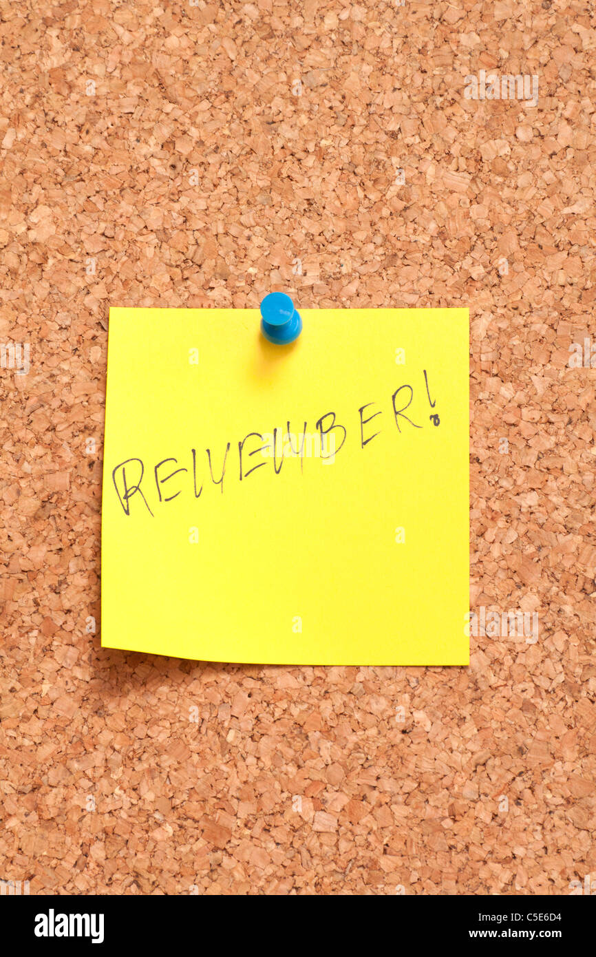 yellow sticker attached to a pin cork board Stock Photo - Alamy