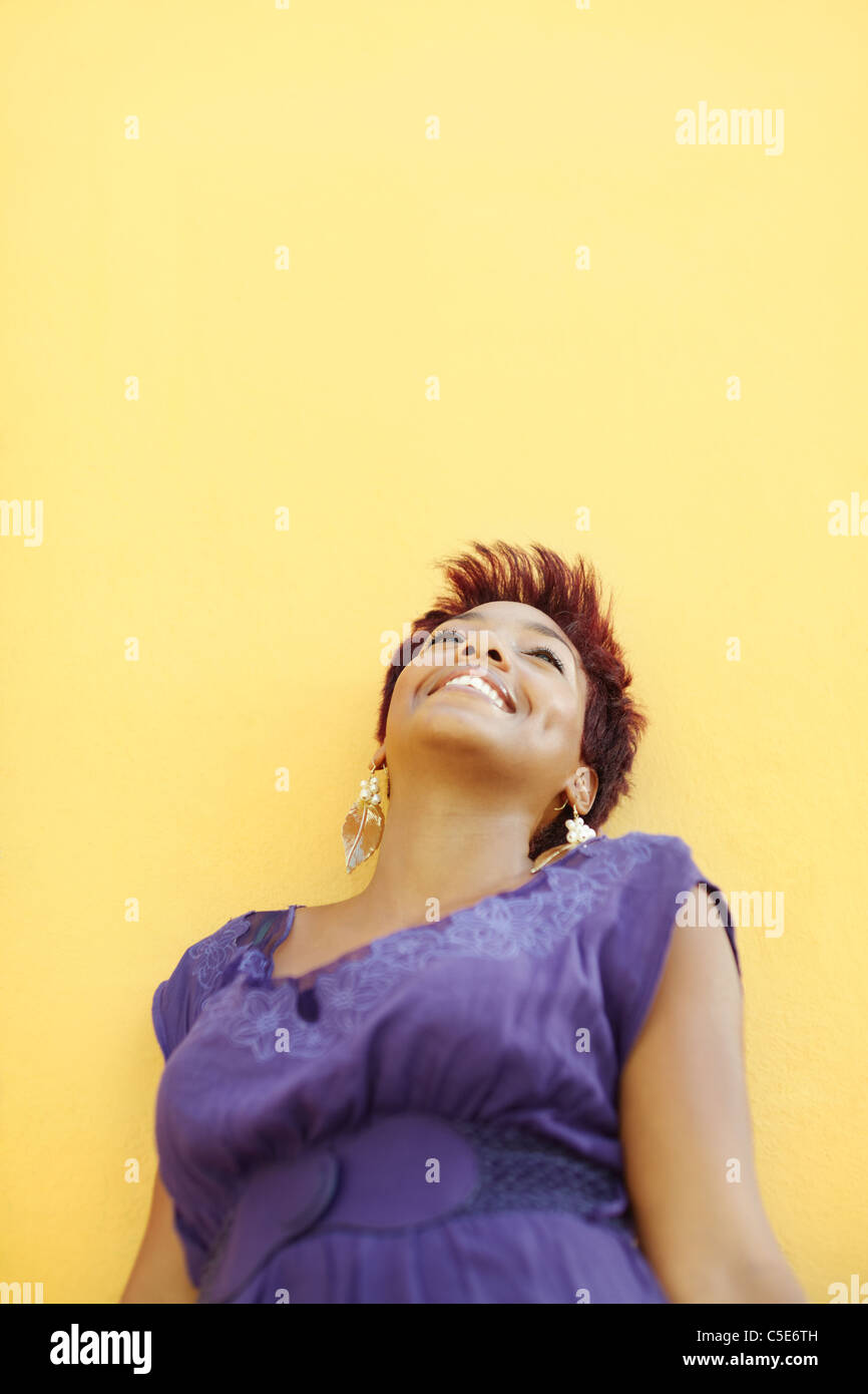 Woman young looking up smiling hi-res stock photography and images - Alamy
