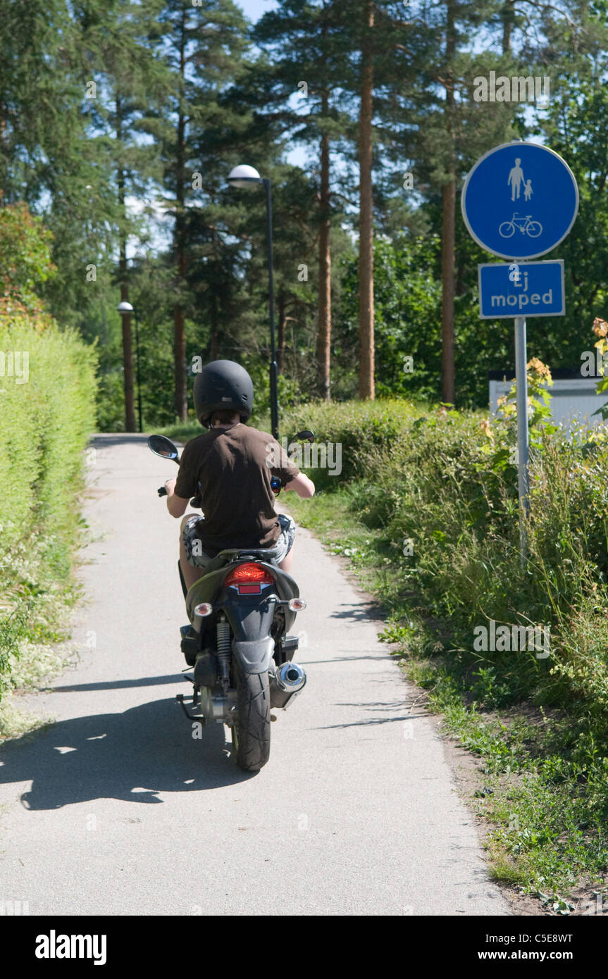 Boy riding a moped hi-res stock photography and images - Alamy