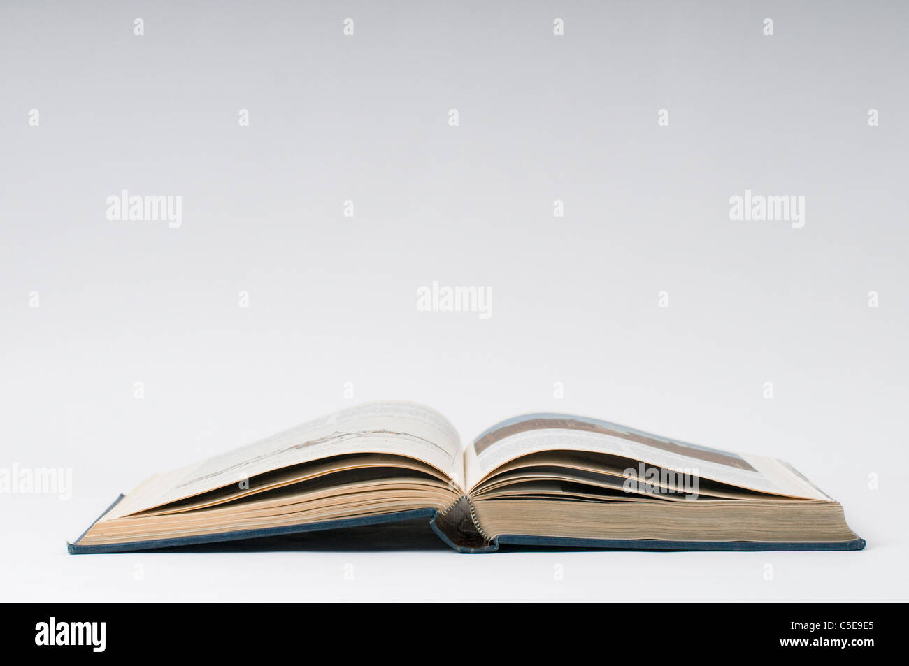 Open book blue background hi-res stock photography and images - Alamy