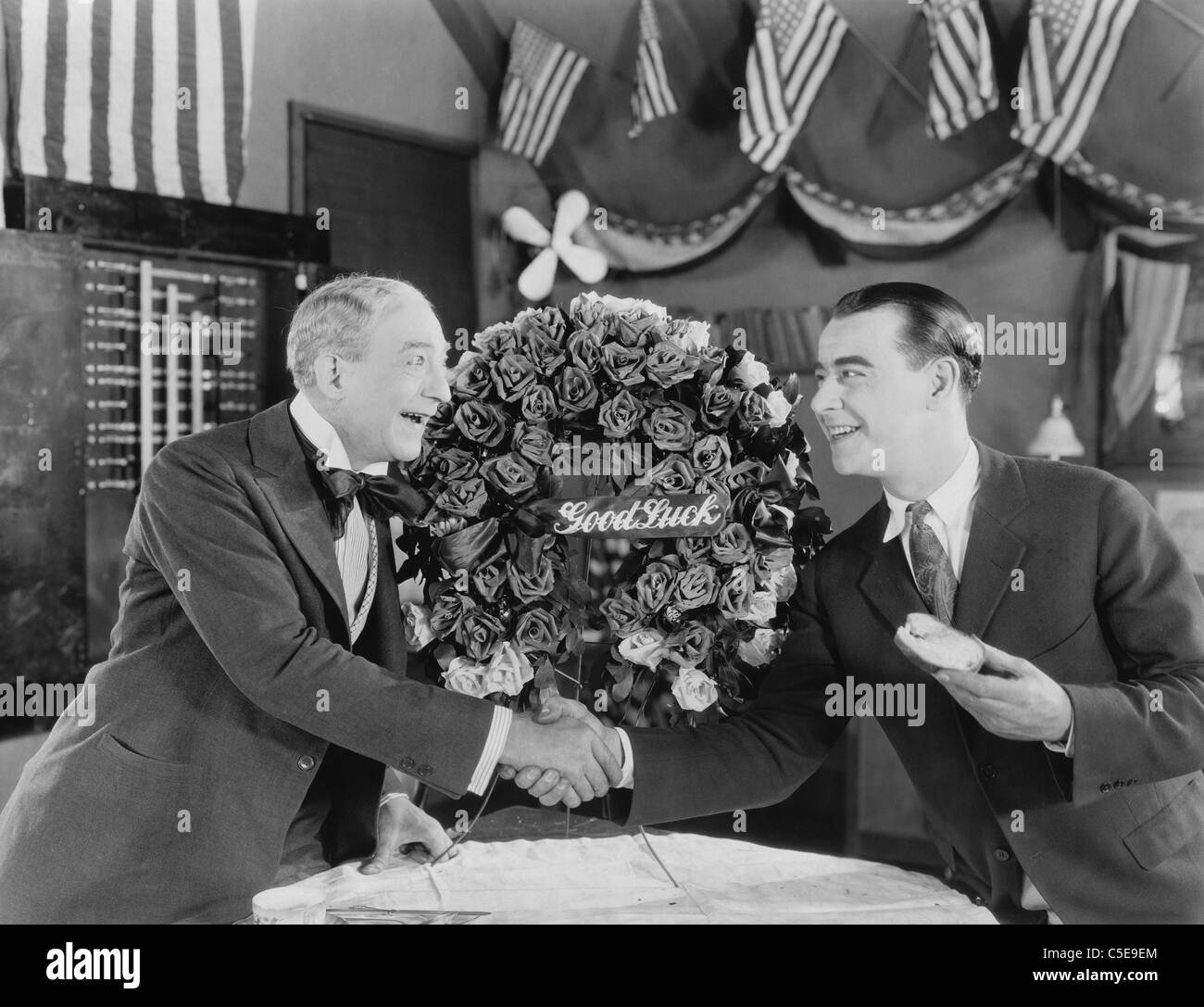 Men wishing each other good luck Stock Photo - Alamy