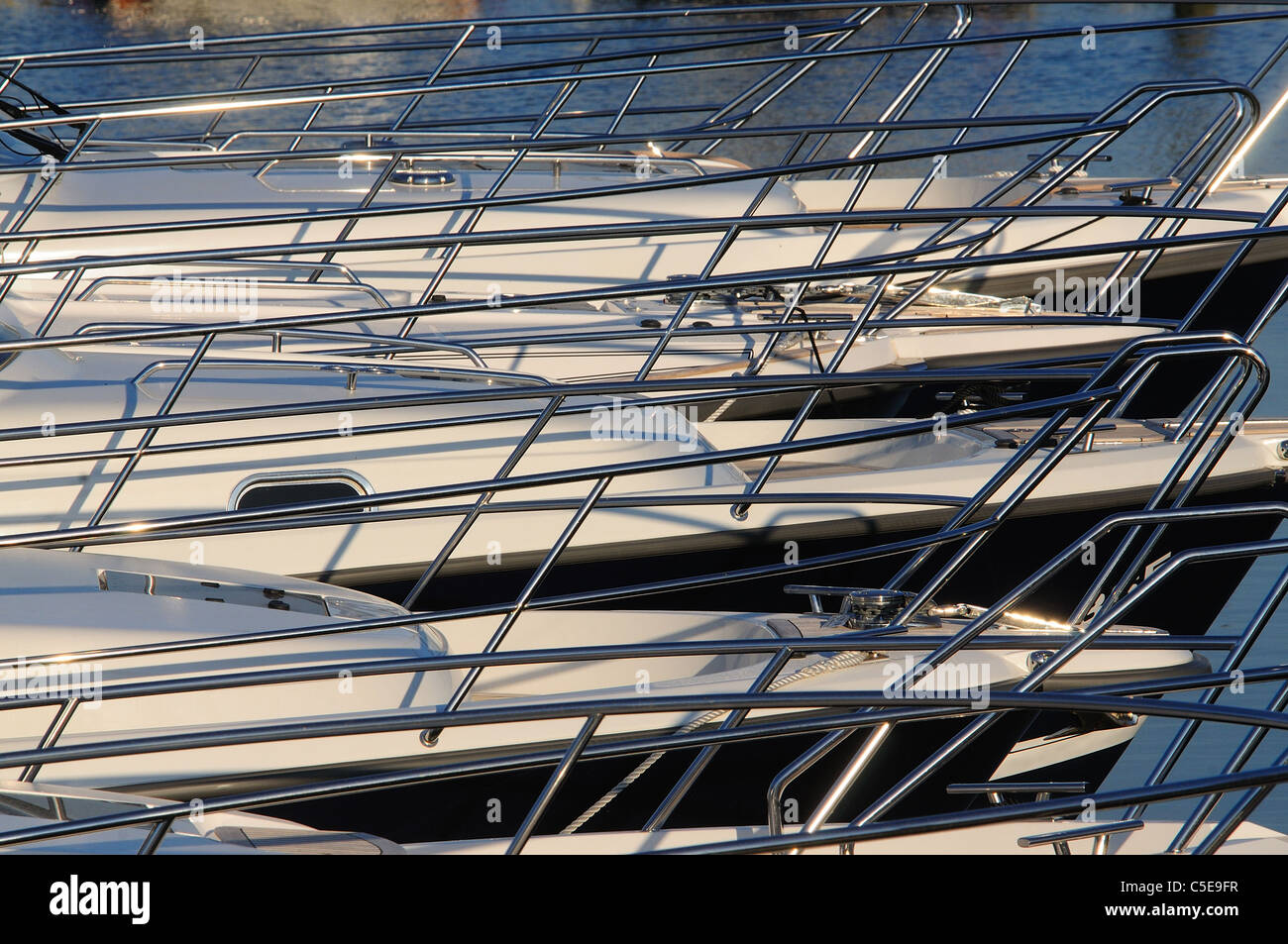 A lline of boats with railings, making a pattern of boats and hand ...