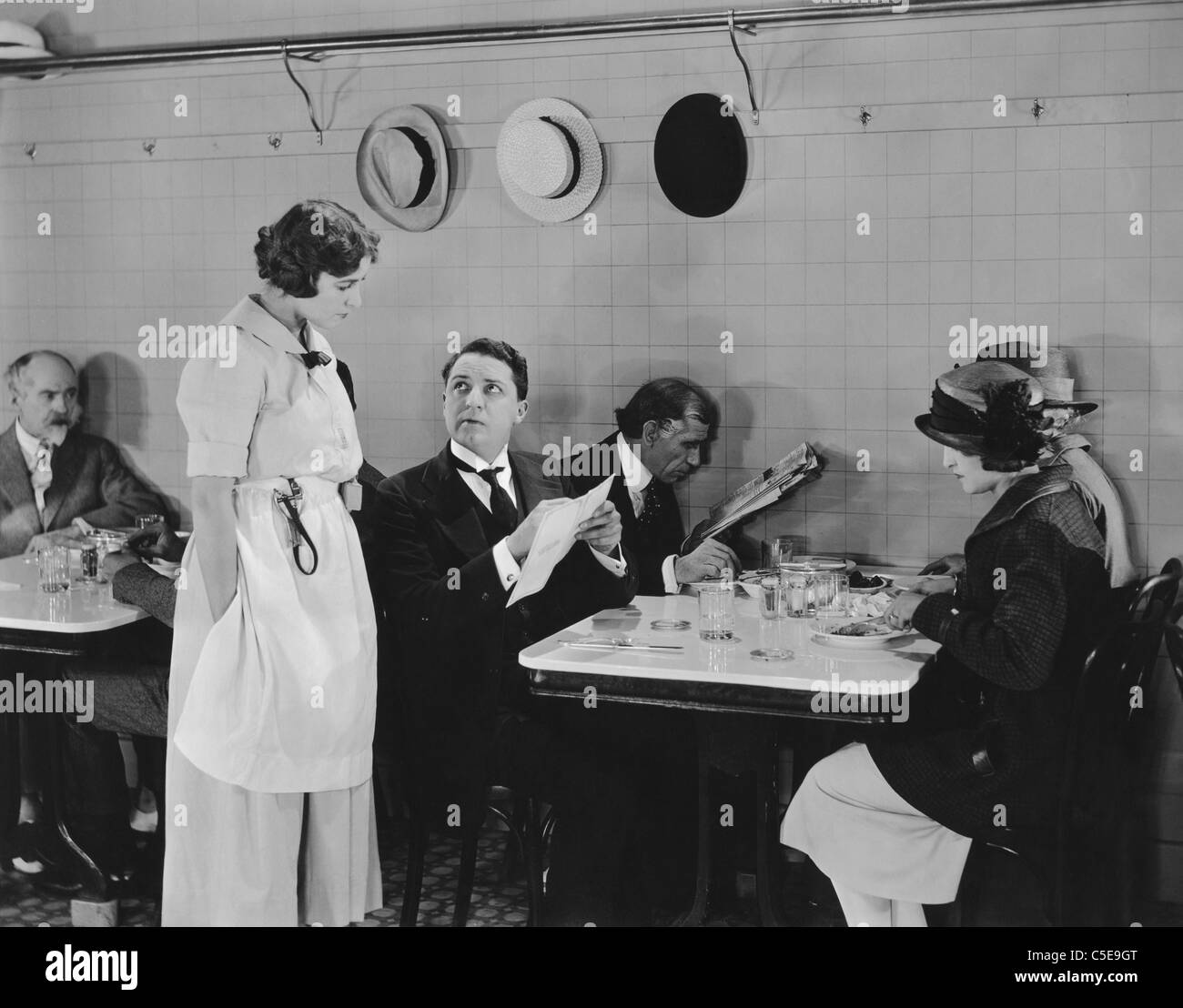 Man restaurant menu in Black and White Stock Photos & Images - Alamy