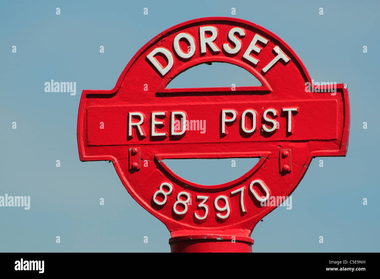 A traditional top of a finger post except that it is red. UK Stock ...