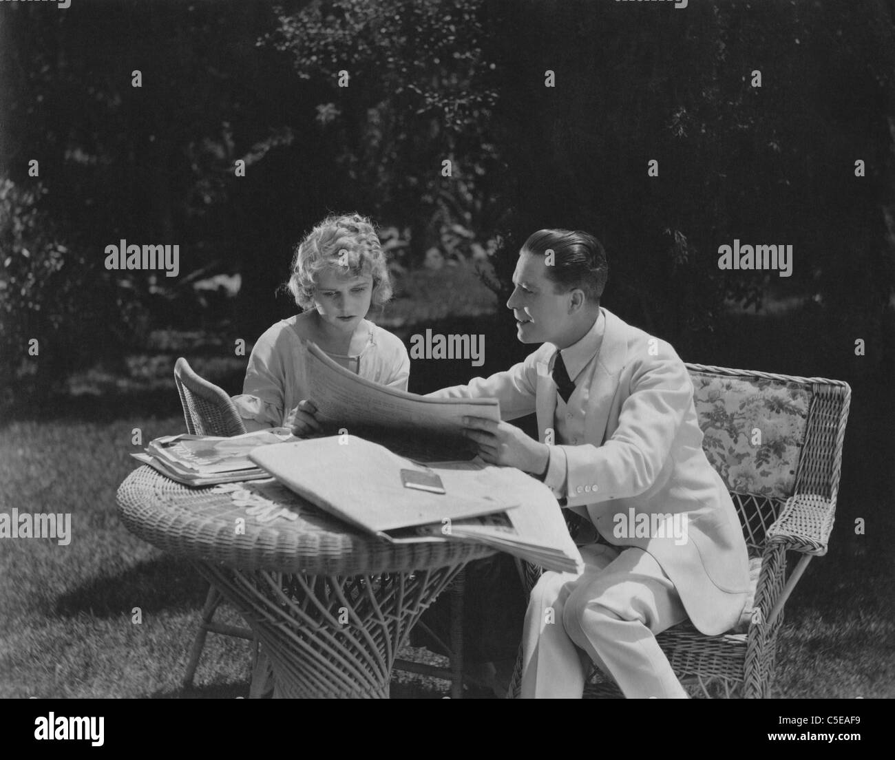 Catching up on the news Stock Photo - Alamy