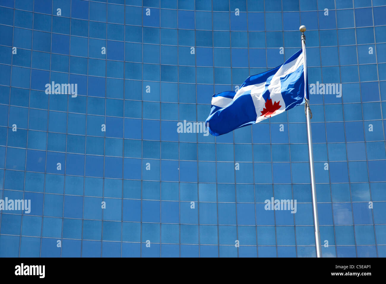 toronto city flag in front of the ontario power generation opg building ...