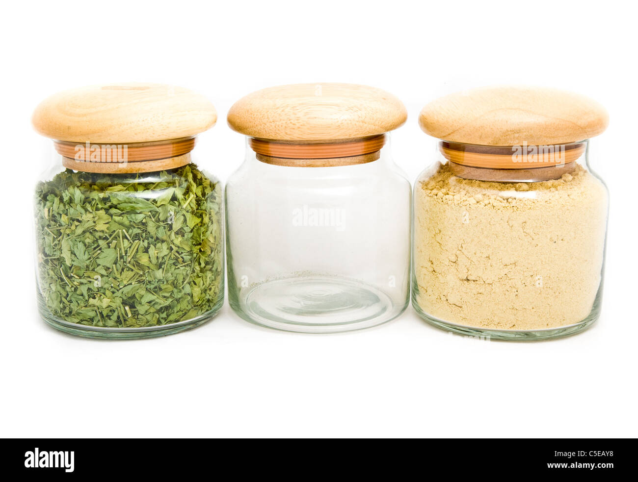 Three glass cans with spices Stock Photo - Alamy