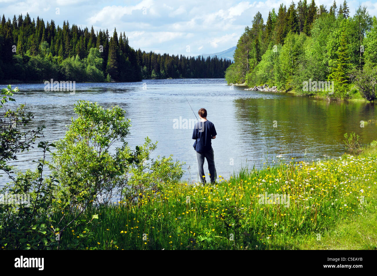 Man boy fly fishing hi-res stock photography and images - Alamy