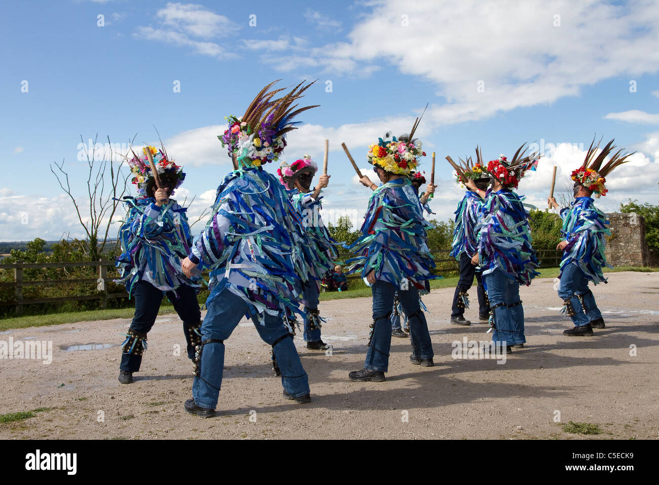 Exmoor Border Morris Dancers, black-faced, wearing long flowing torn ...