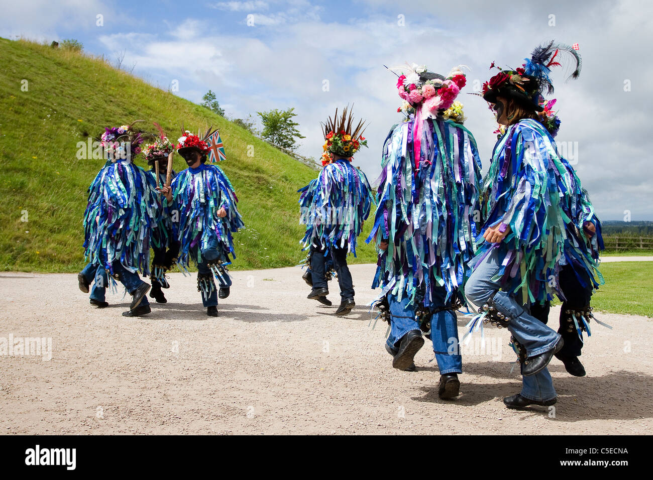 Exmoor Border Morris Dancers, black-faced, wearing long flowing torn ...