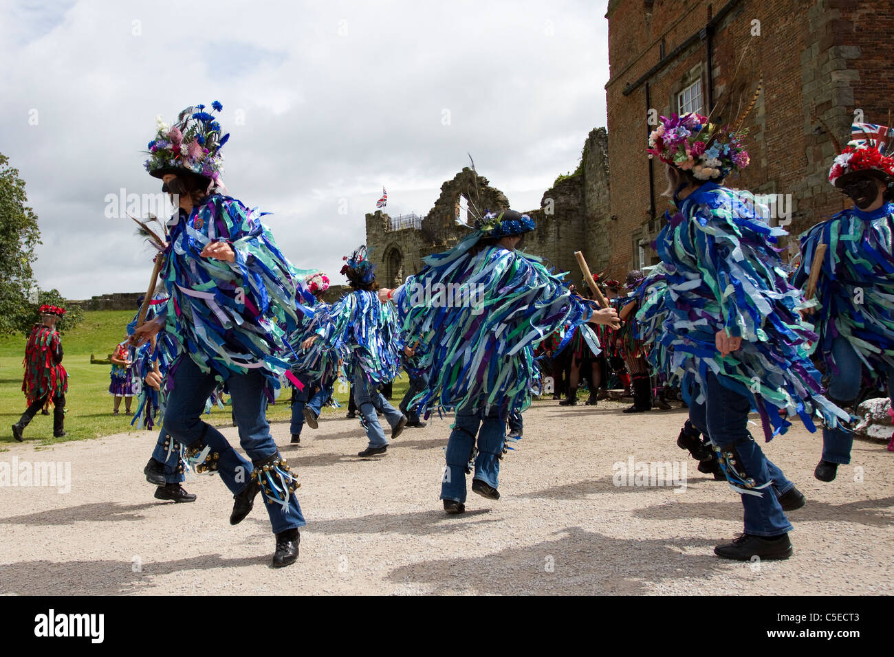 Exmoor Border Morris Dancers, black-faced, wearing long flowing torn ...