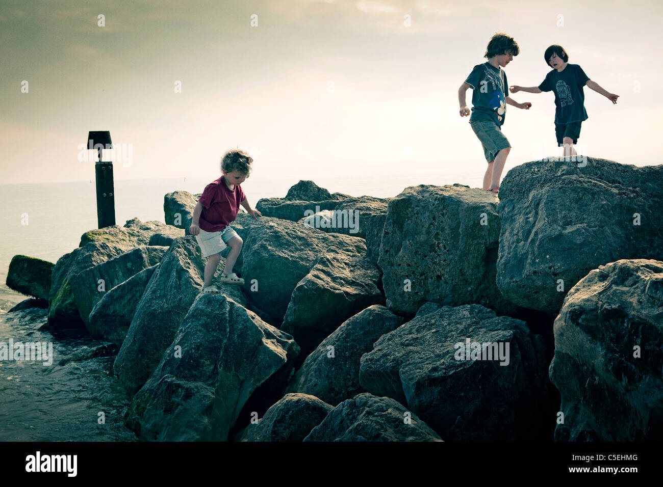 Child playing with rocks hi-res stock photography and images - Alamy