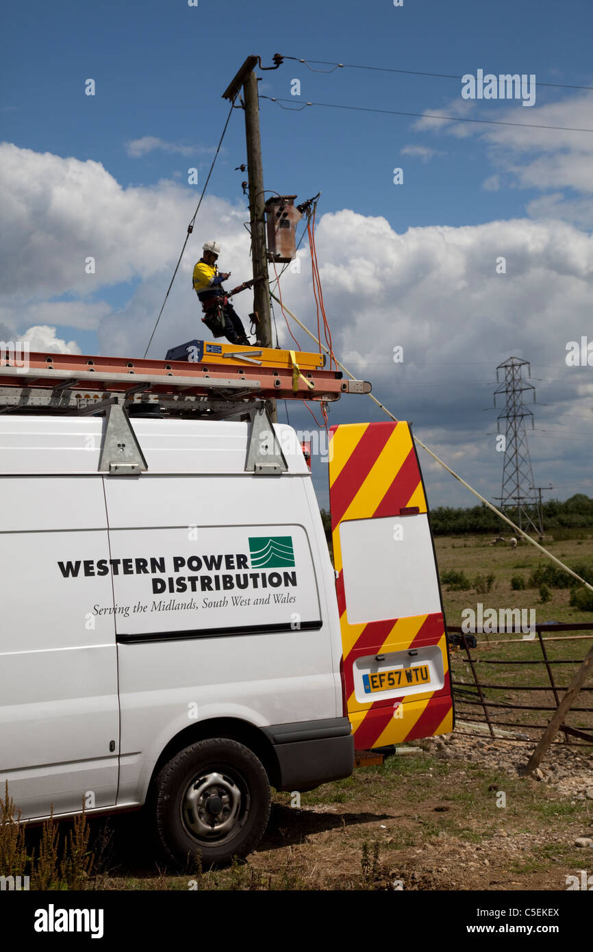 Western Power engineer reconnecting transformer on elecricity pole from ...