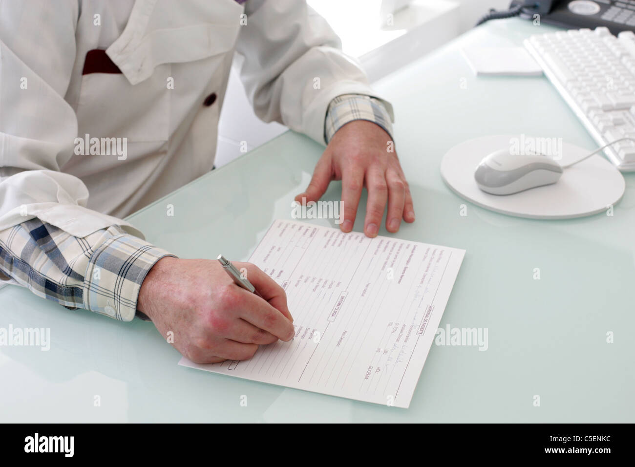 Doctor writing a prescription Stock Photo - Alamy