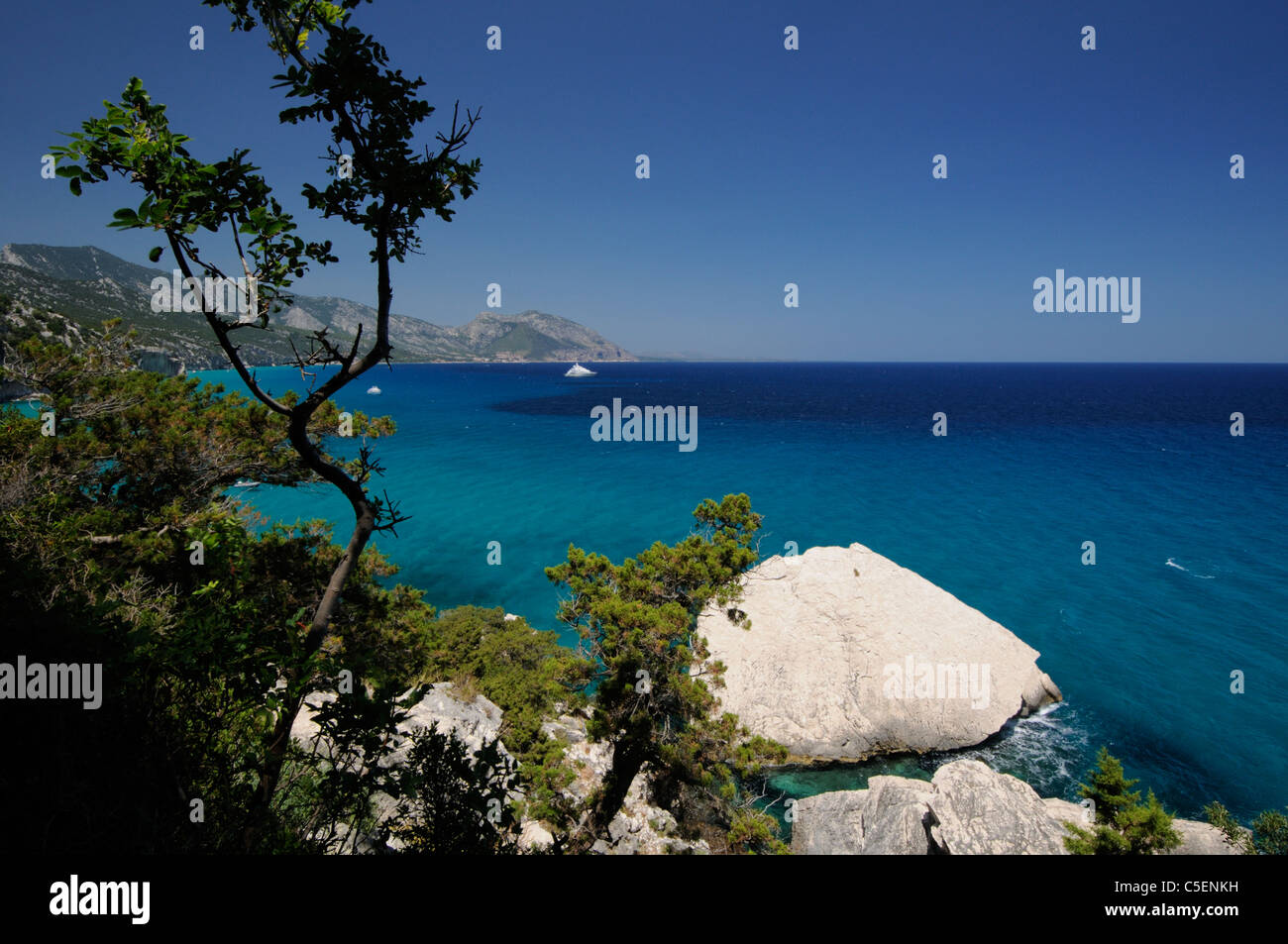 White rocks,yachts and transparent water at Cala Luna,Cala Gonone ...